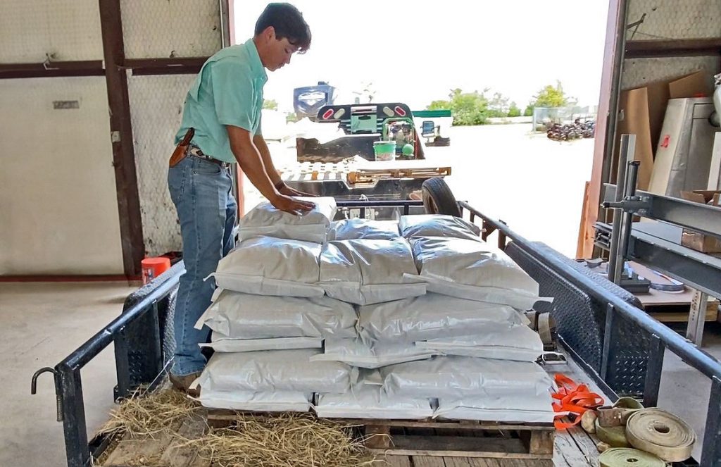 Bagging Machine fills 25 Lb. Bags with Horse Pellets